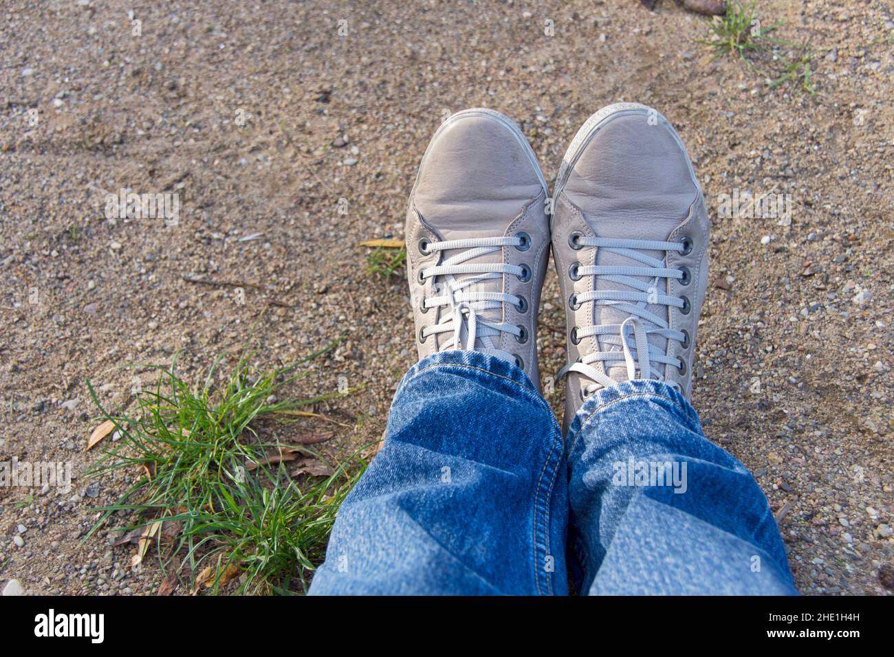 Closeup of feet on the ground Stock Photo - Alamy