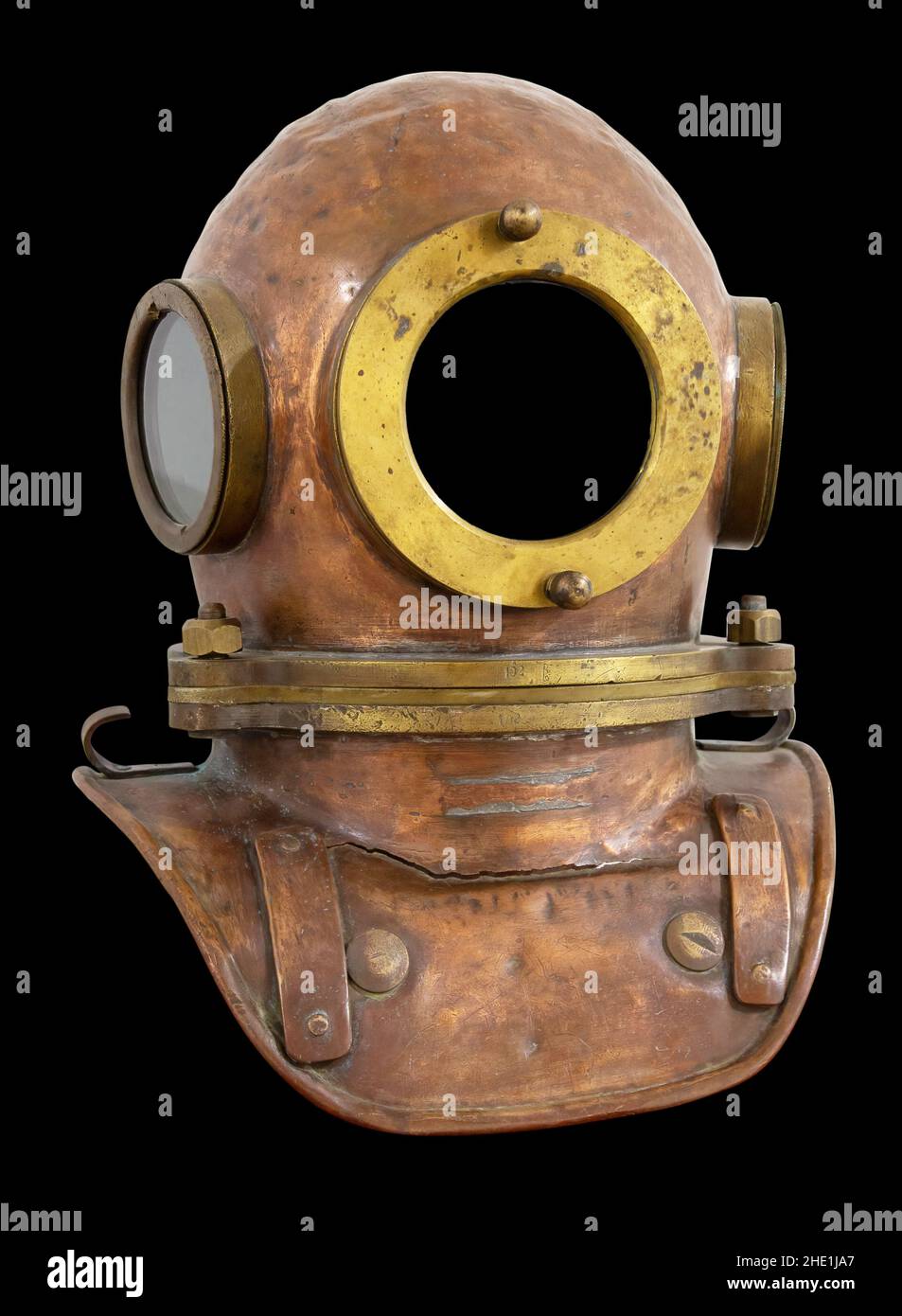 Old antique metal scuba helmet isolated on black background with ...