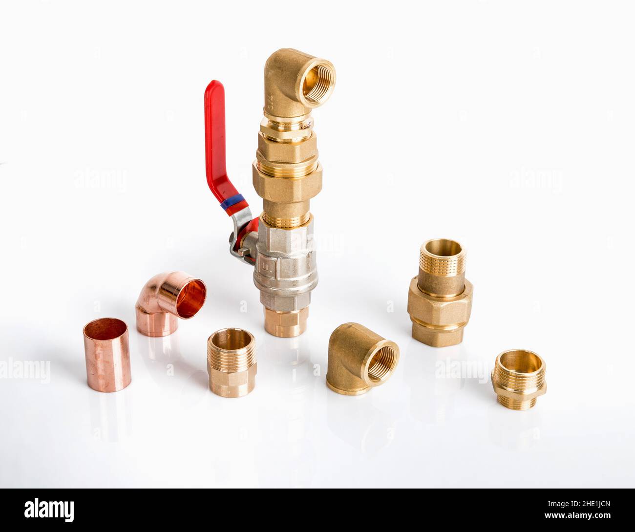 Plumbing valves, ball valves, fasteners and fittings on the white ...