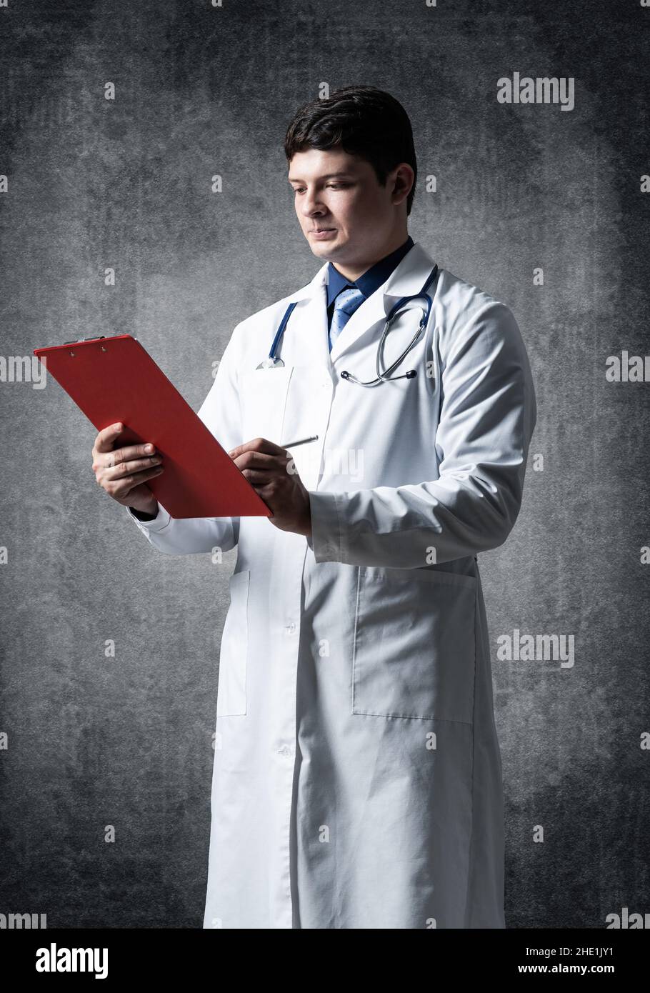 Doctor with tablet for documents Stock Photo - Alamy
