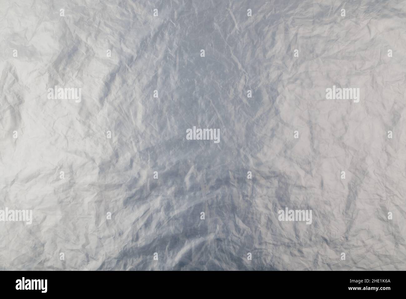 full frame background of flat crumpled semi-transparent polyethylene ...