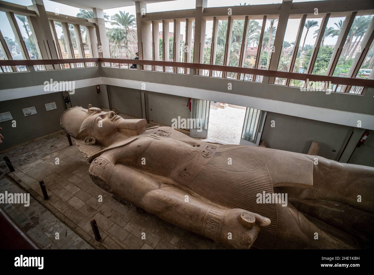 A giant statue of Rameses II, an Egyptian pharaoh lies in the museum ...