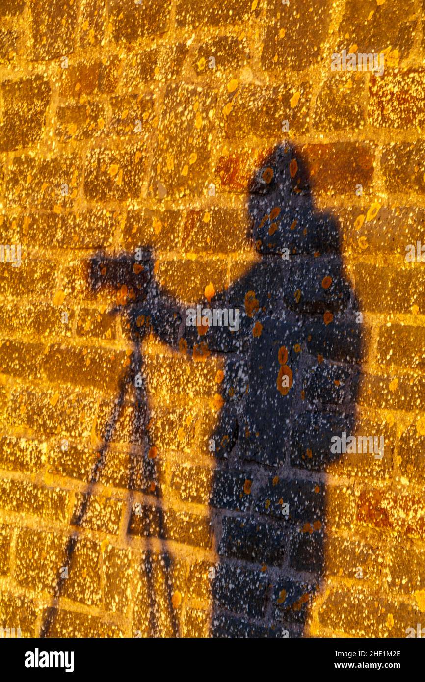 Camera shadow on a stone wall Stock Photo - Alamy