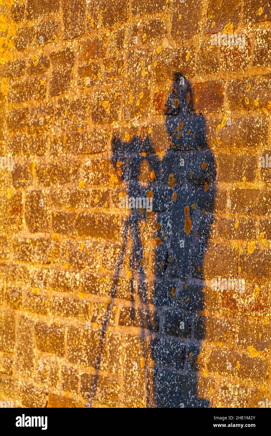 Camera shadow on a stone wall Stock Photo - Alamy