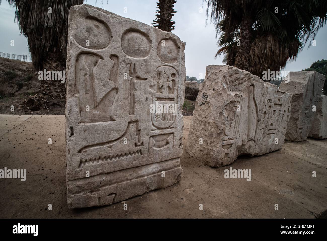 An ancient stone slab with egyptian hieroglyphs carved on it sits ...