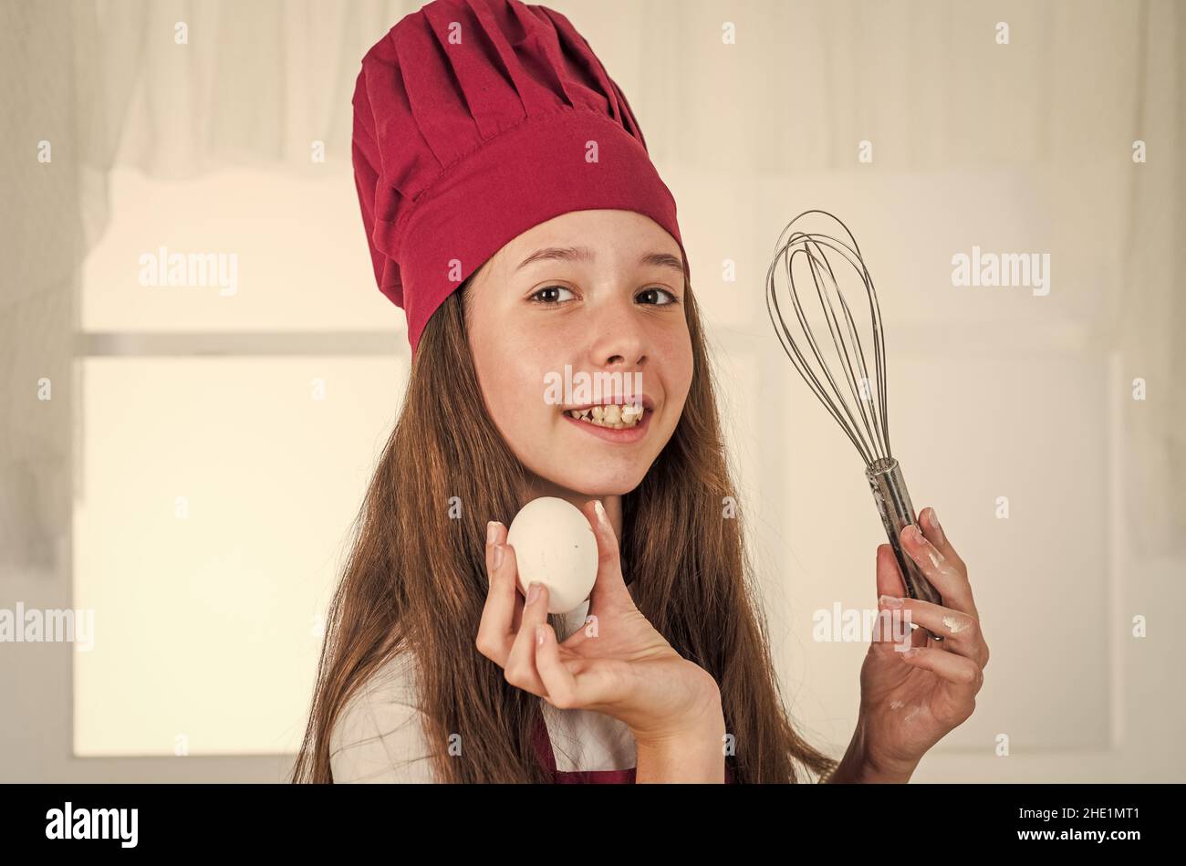 child with egg and beater, kitchen utensil Stock Photo - Alamy