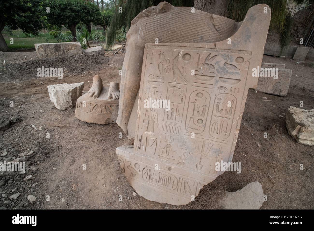 An ancient stone slab with egyptian hieroglyphs carved on it sits ...