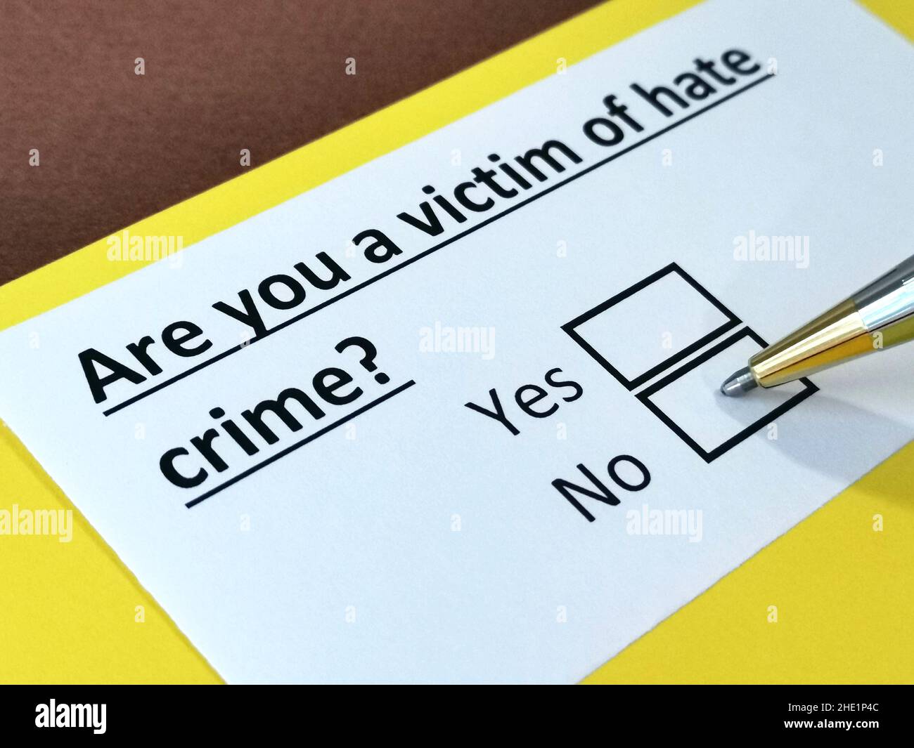 One person is answering question about hate crime Stock Photo - Alamy