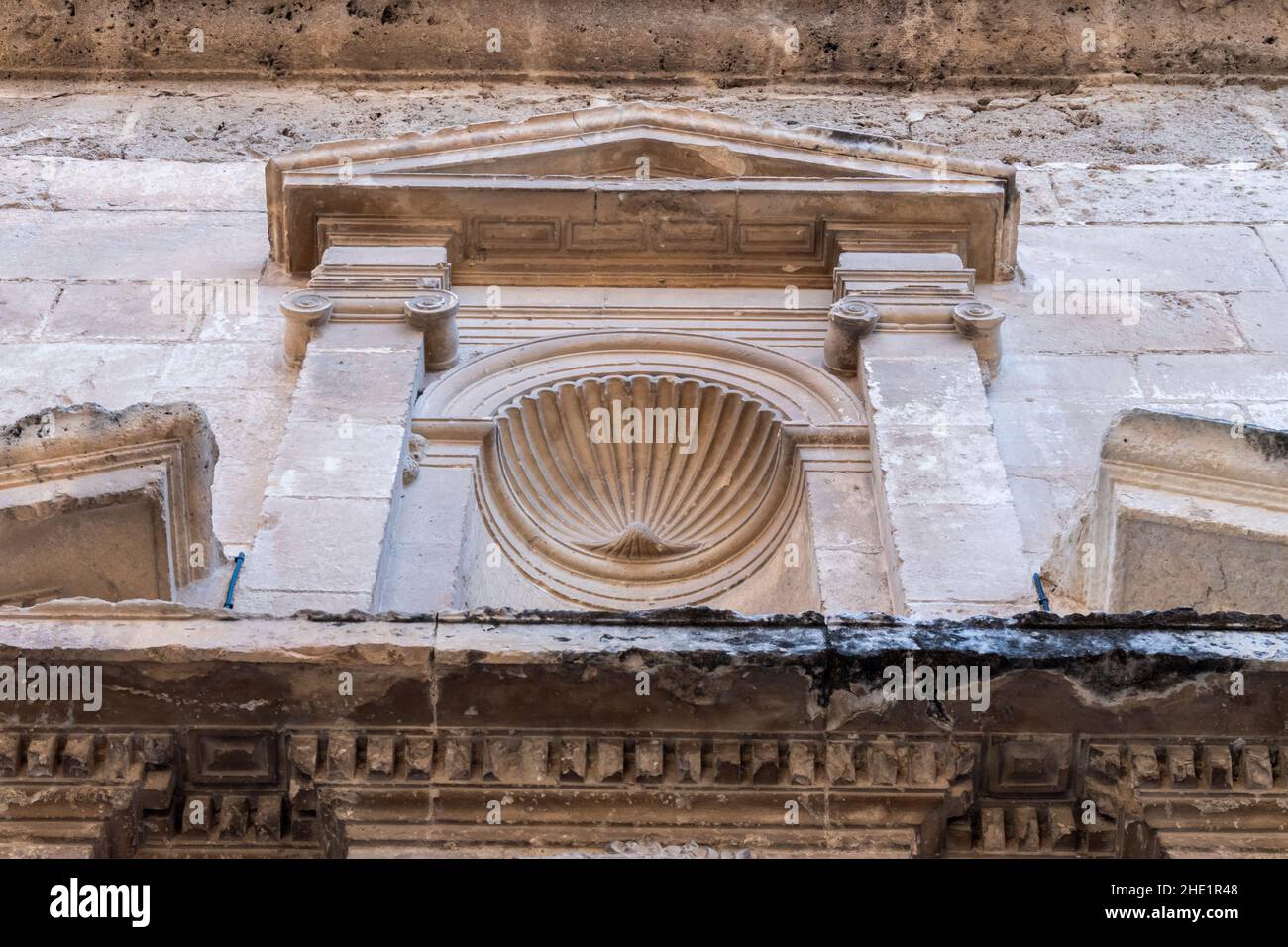 Low angle shot of a detail of sculptural design of old baroque building ...