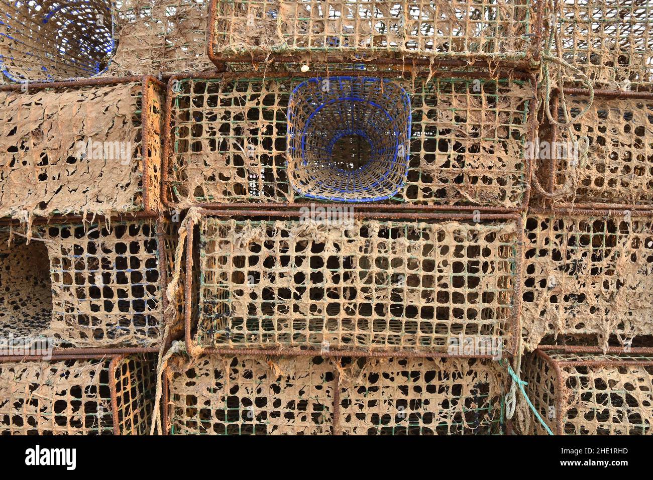 Steel traps for harvesting shellfish piled up in port of Olhao Algarve ...