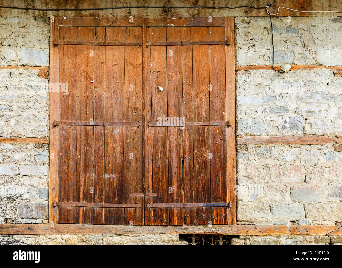 Old window closed with wooden shutters Stock Photo - Alamy