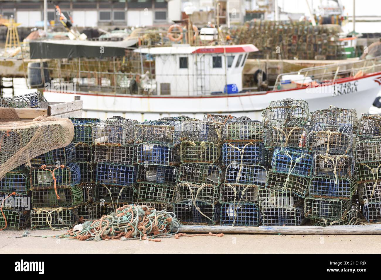 Steel traps for harvesting shellfish piled up in port of Olhao Algarve ...