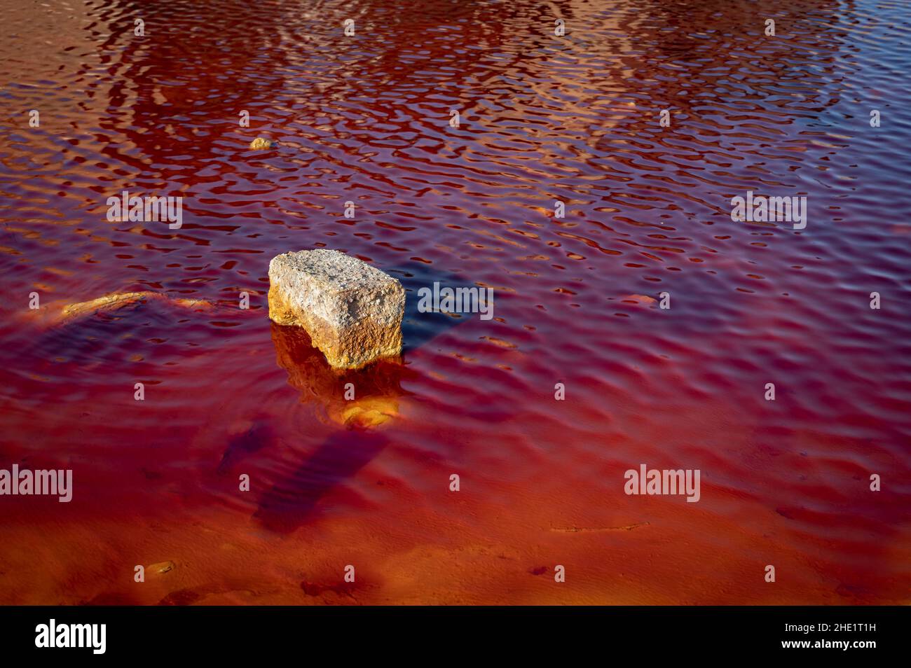 Puddle of red water in the mines of Mazarron Stock Photo - Alamy
