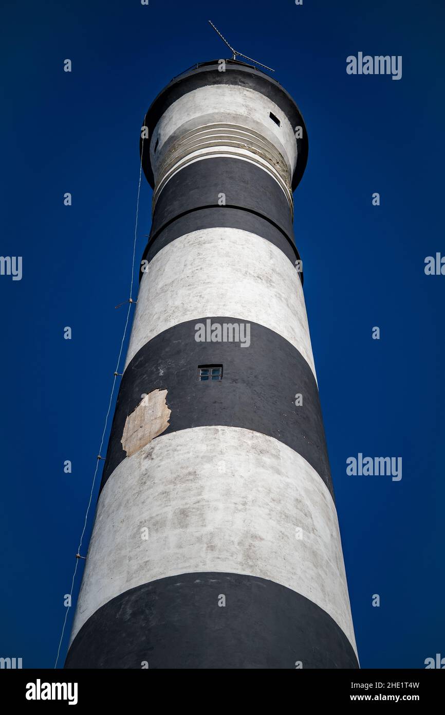 A vertical view of a striped lighthouse in Villa Gesell Partido ...
