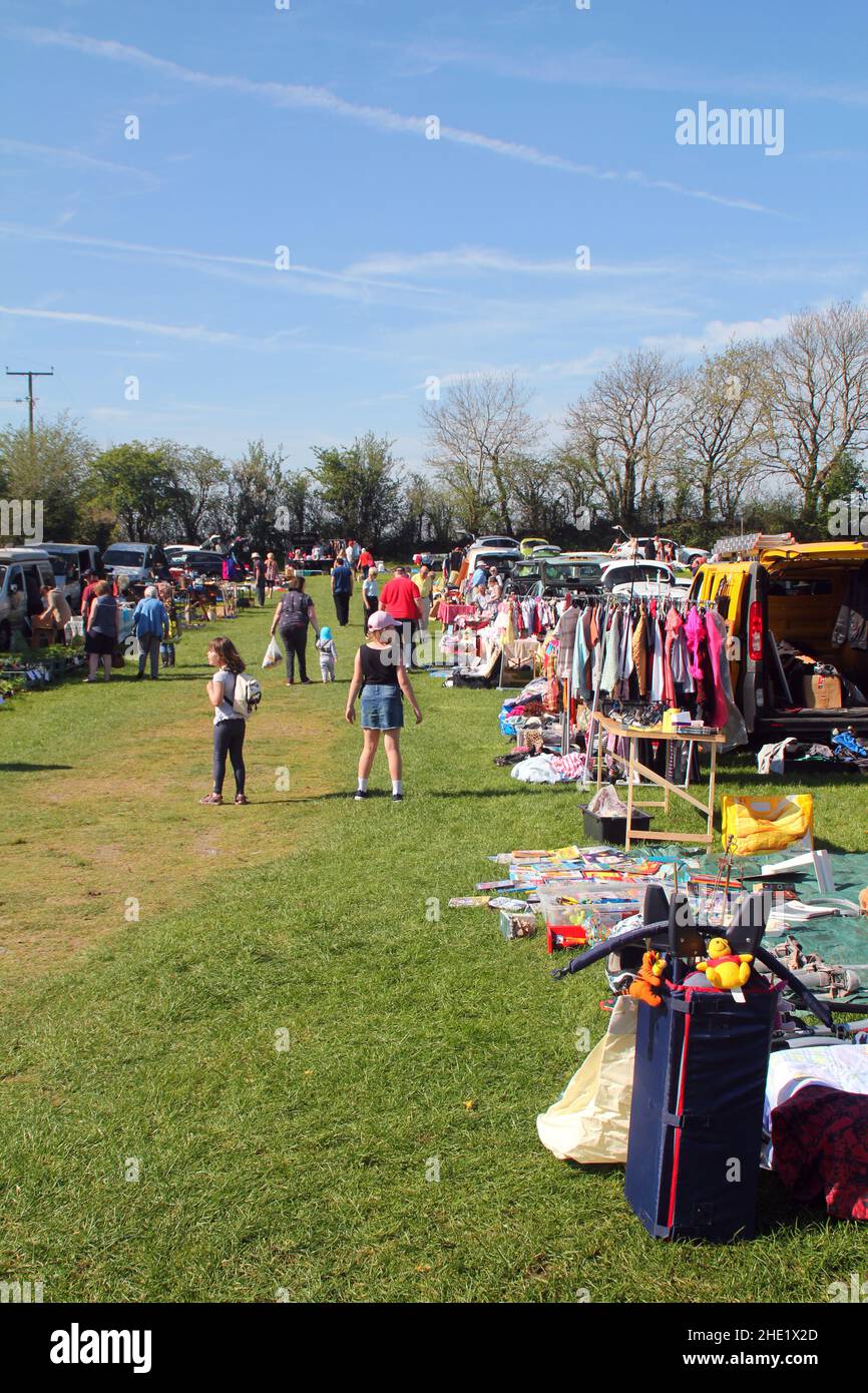 Pennant car boot sale, showing stalls set up by cars and people walking ...
