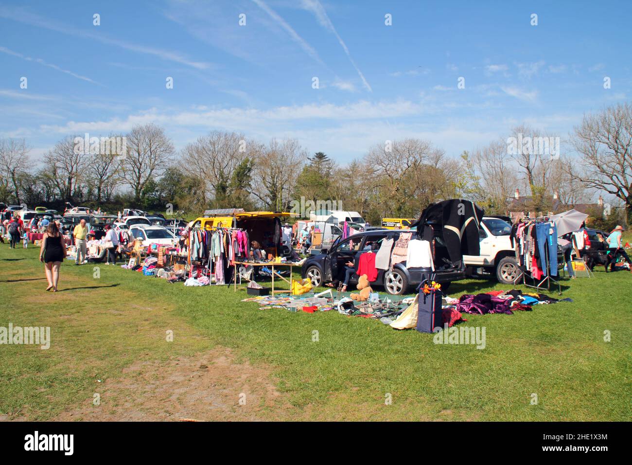 Pennant car boot sale, showing stalls set up by cars and people walking ...