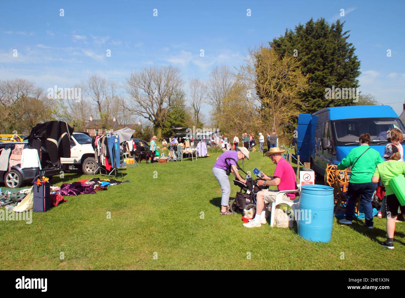 Pennant car boot sale, showing stalls set up by cars and people walking ...