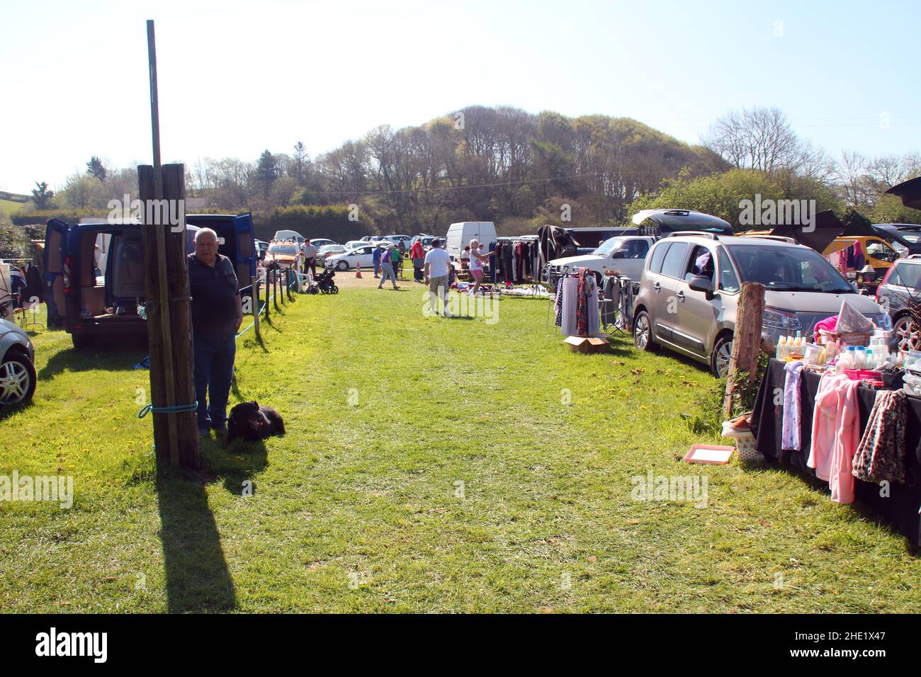 Pennant car boot sale, showing stalls set up by cars and people walking ...
