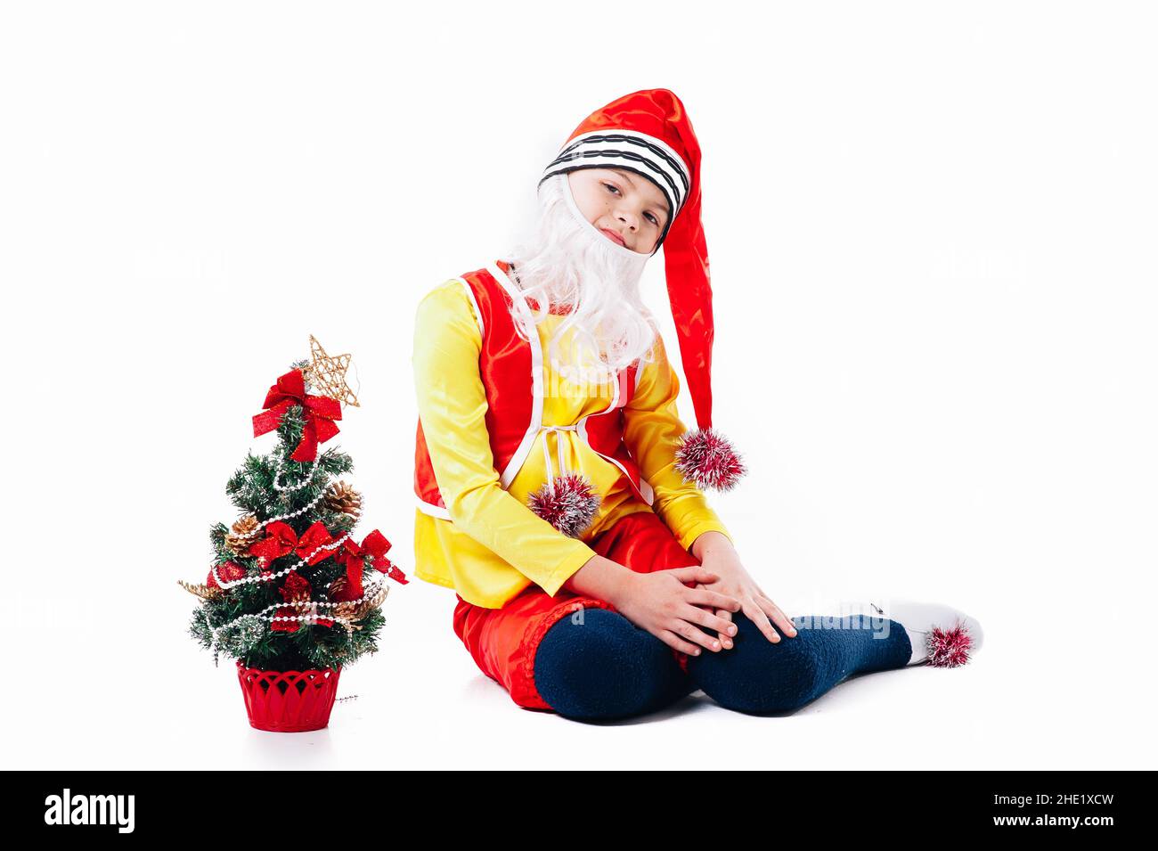 A baby dressed as a elf. isolated. Santa's helper. boy in suit of dwarf ...