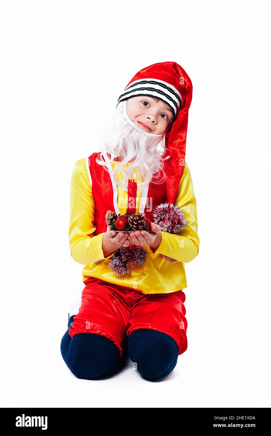 A baby dressed as a elf. isolated. Santa's helper. boy in suit of dwarf ...