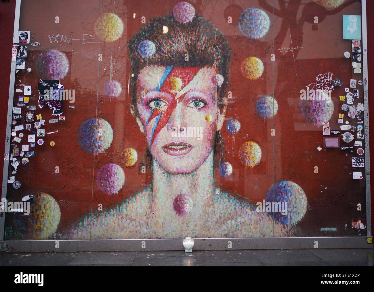 A candle tribute is placed at the David Bowie mural in Brixton, south ...