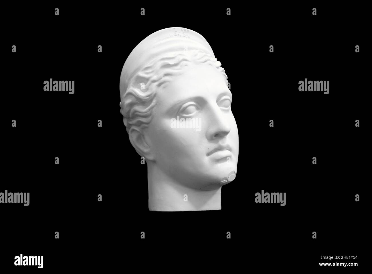 bust head of a woman made of plaster cast isolated on black background ...