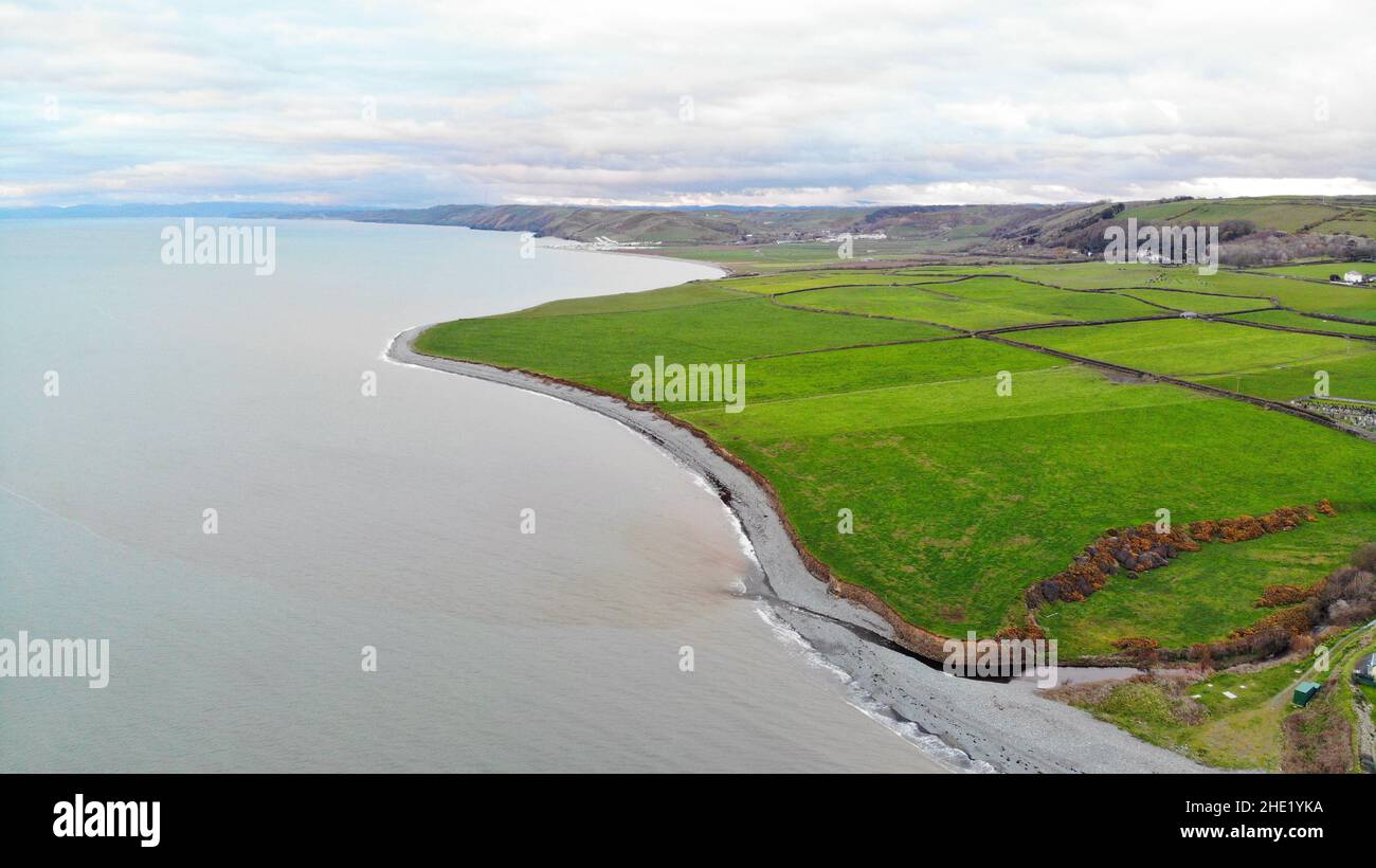 Aerial image of the Welsh coast and cliff in Llannon, Ceredigion. Blue ...