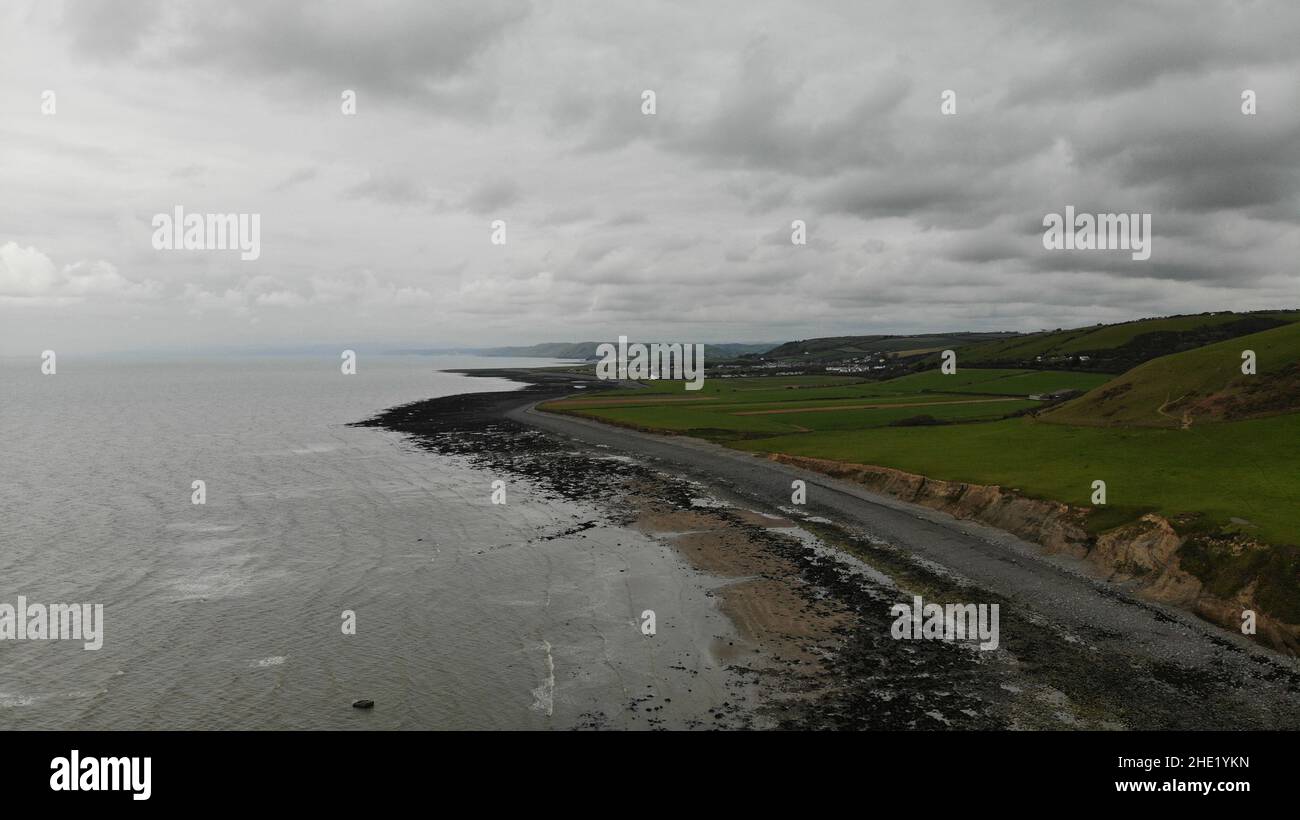 Aerial image of the Welsh coast and cliff in Llannon, Ceredigion. Blue ...