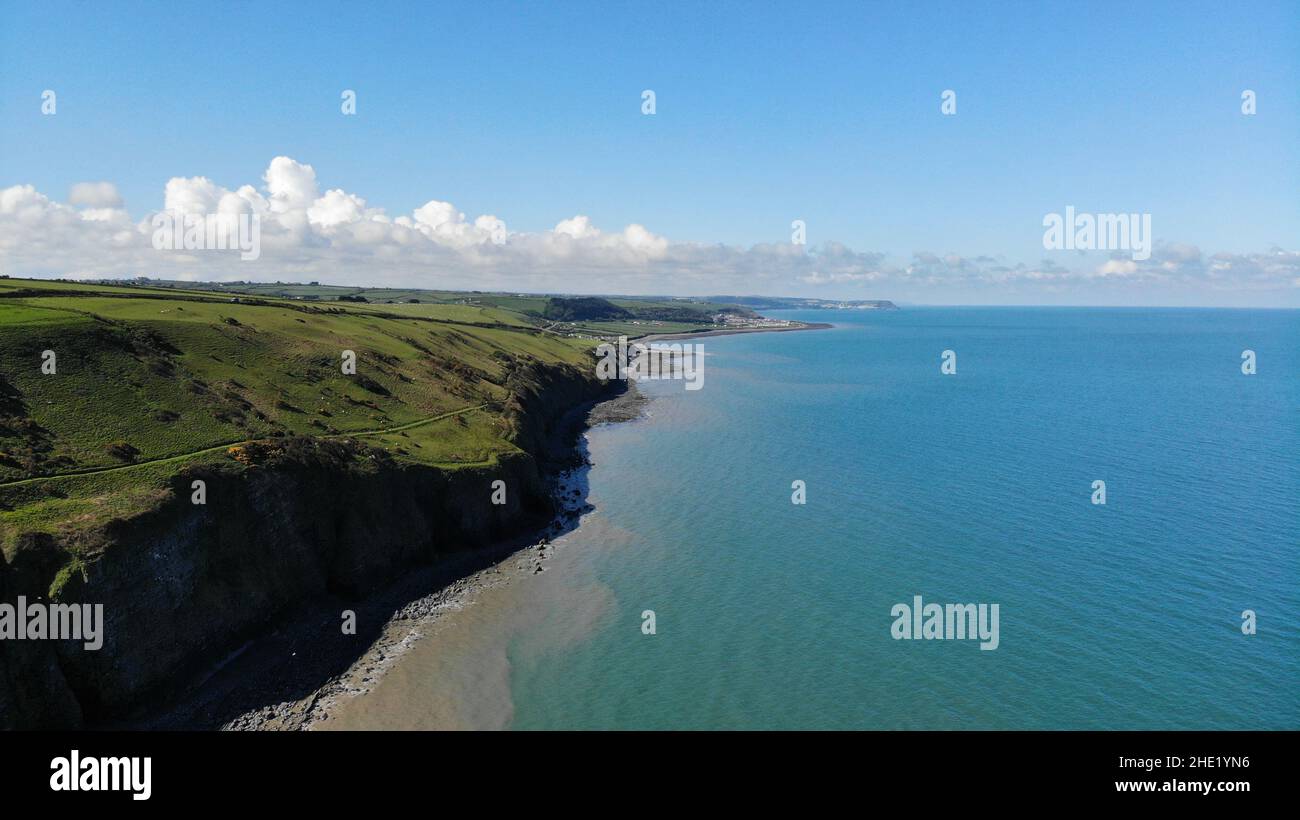 Aerial image of the Welsh coast and cliff in Llannon, Ceredigion. Blue ...