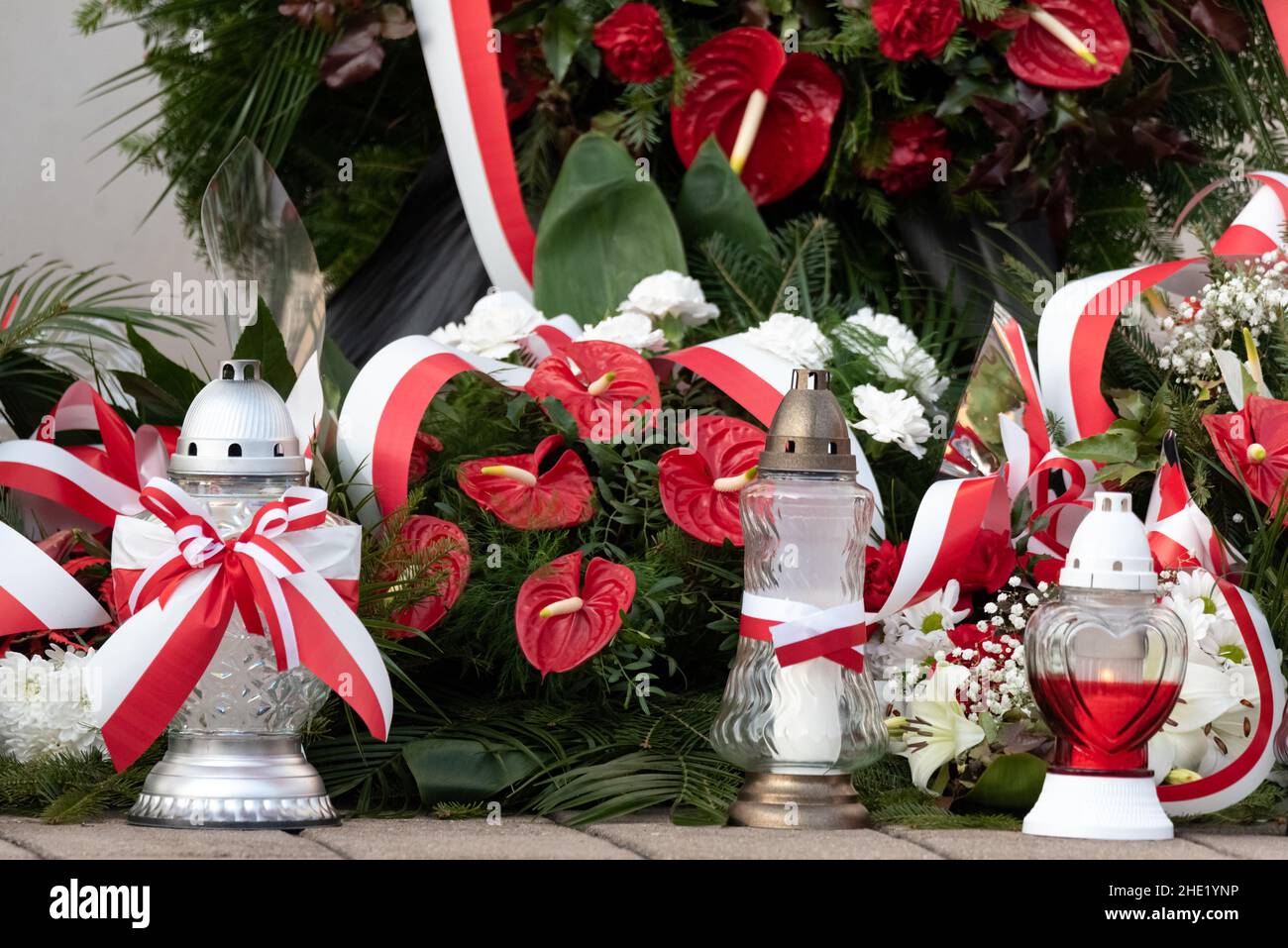 Red and white candles and flowers in the colors of the Polish flag ...