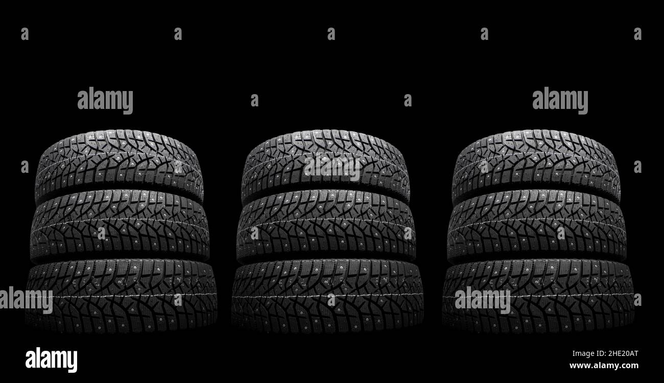 Winter studded tire. Winter car tires isolated on black background ...