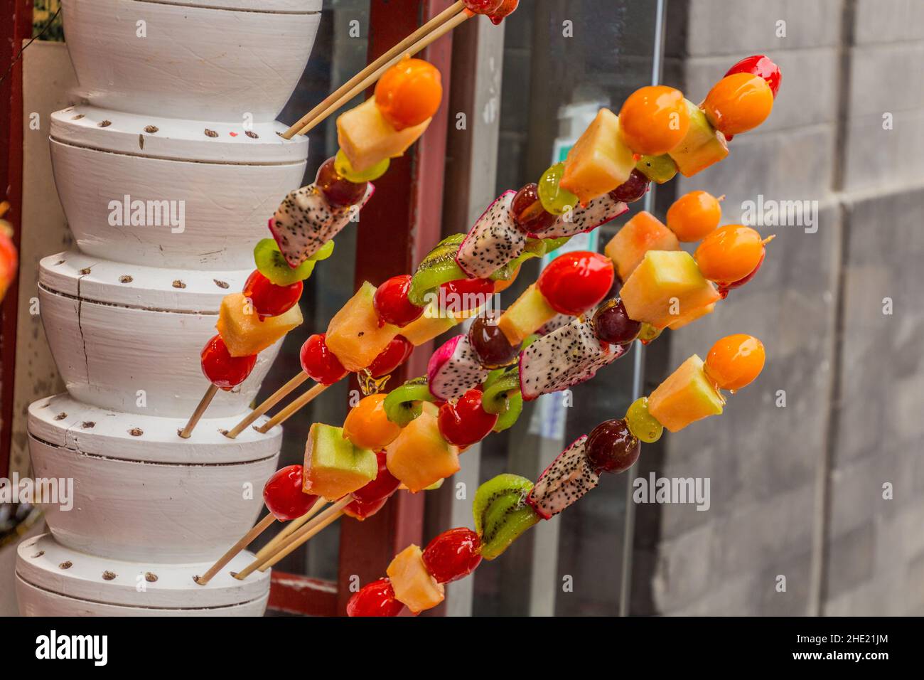 Fruits on skewers, street food in Beijing, China Stock Photo - Alamy