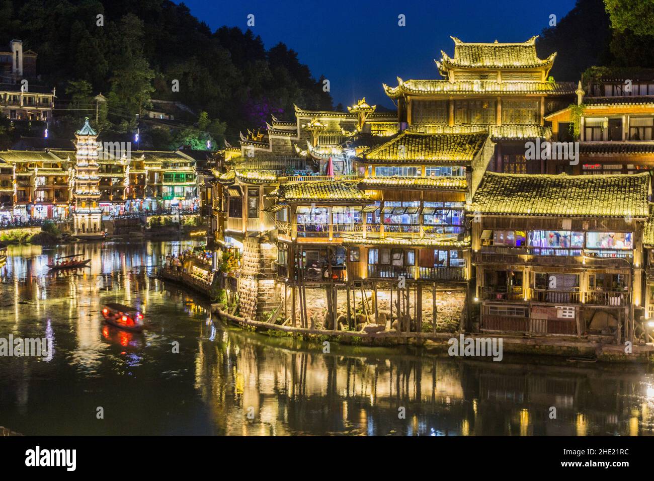 Evening view of riverside houses in Fenghuang Ancient Town, Hunan ...