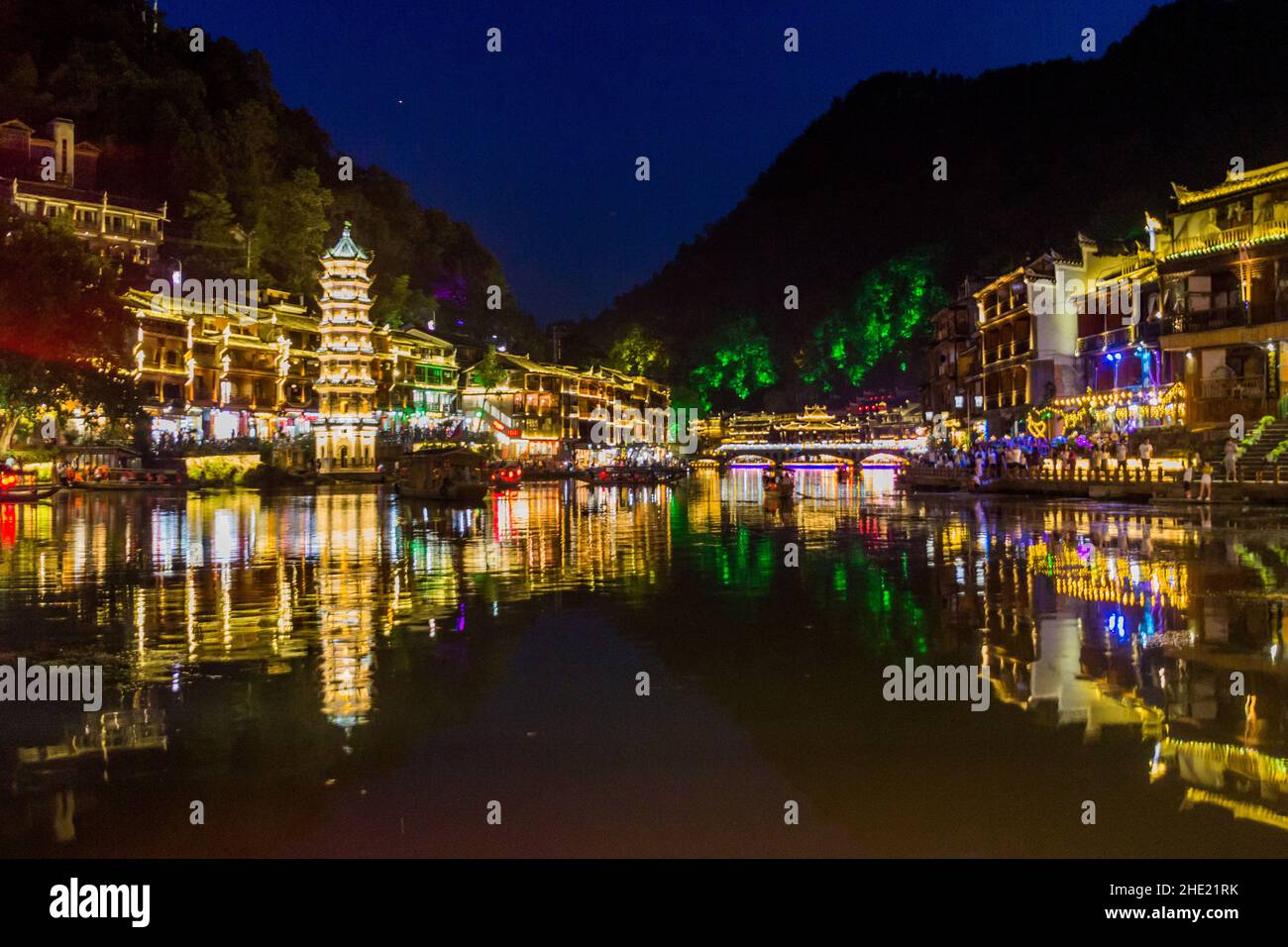 Evening view of riverside houses in Fenghuang Ancient Town, Hunan ...