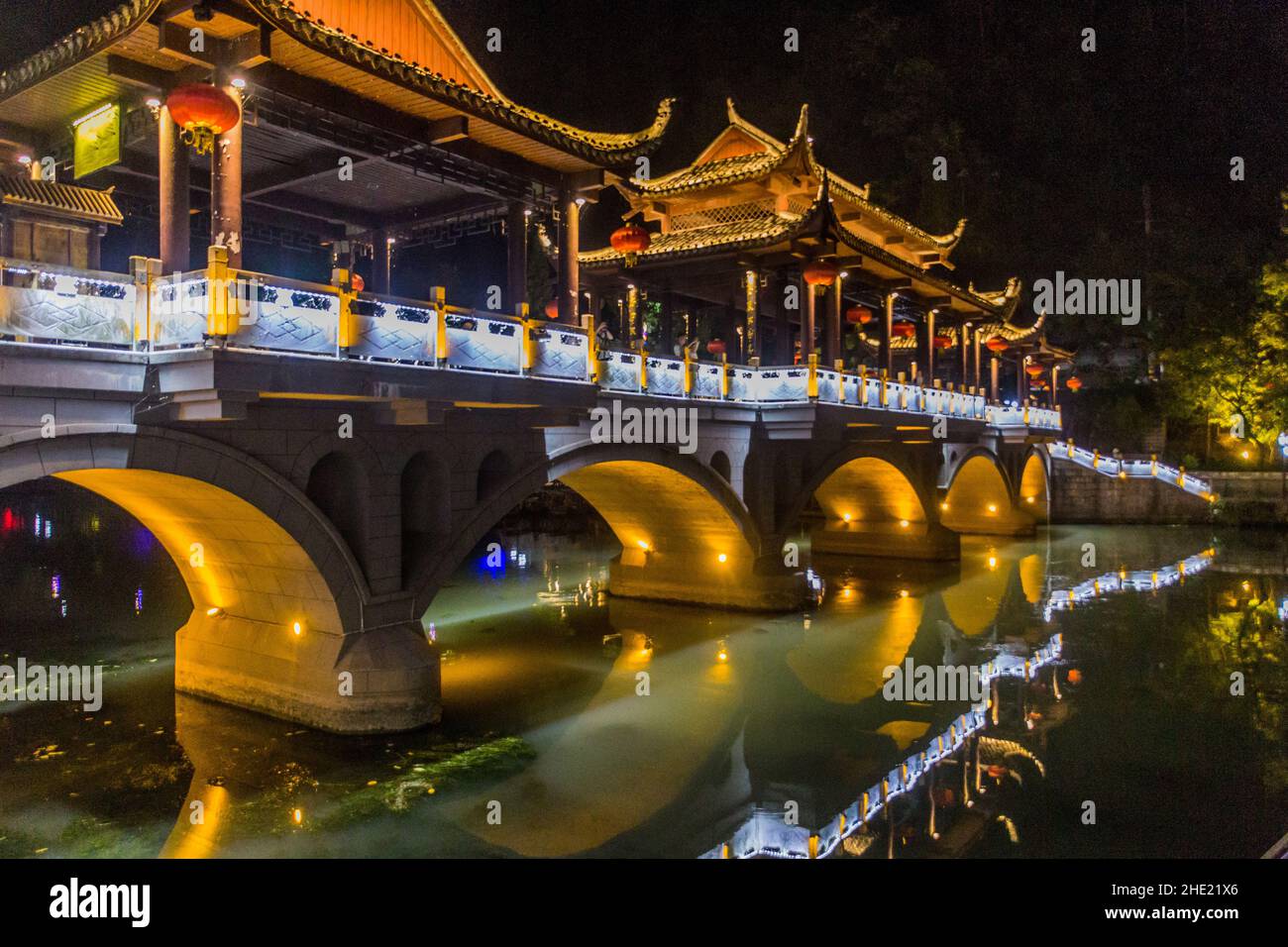 Night view of a bridge in Fenghuang Ancient Town, Hunan province, China ...