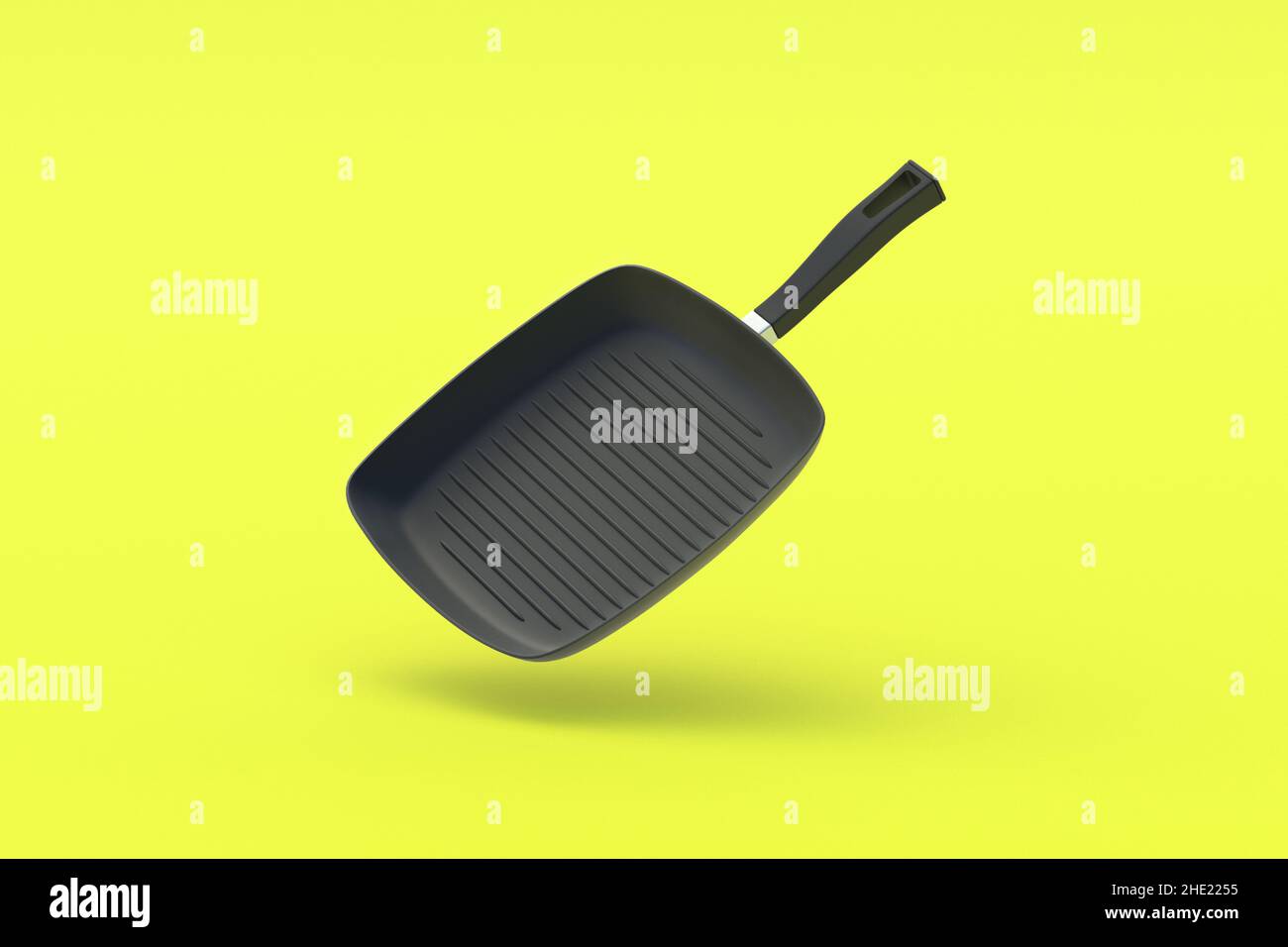 Frying pan for grill with ribbed surface on yellow background. Cooking ...