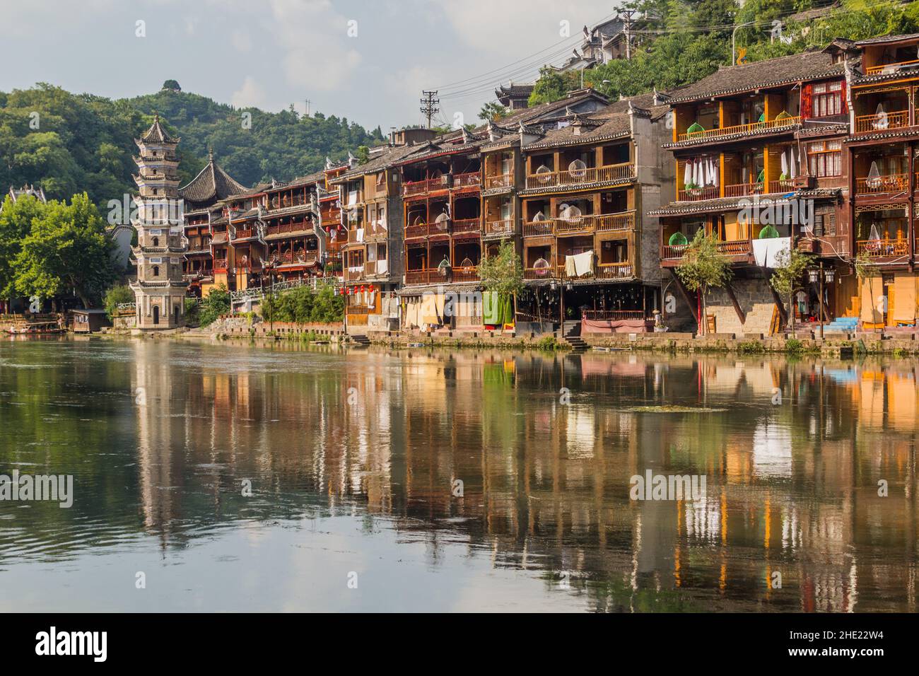 Riverside buildings and Wanming Pagoda in Fenghuang Ancient Town, Hunan ...