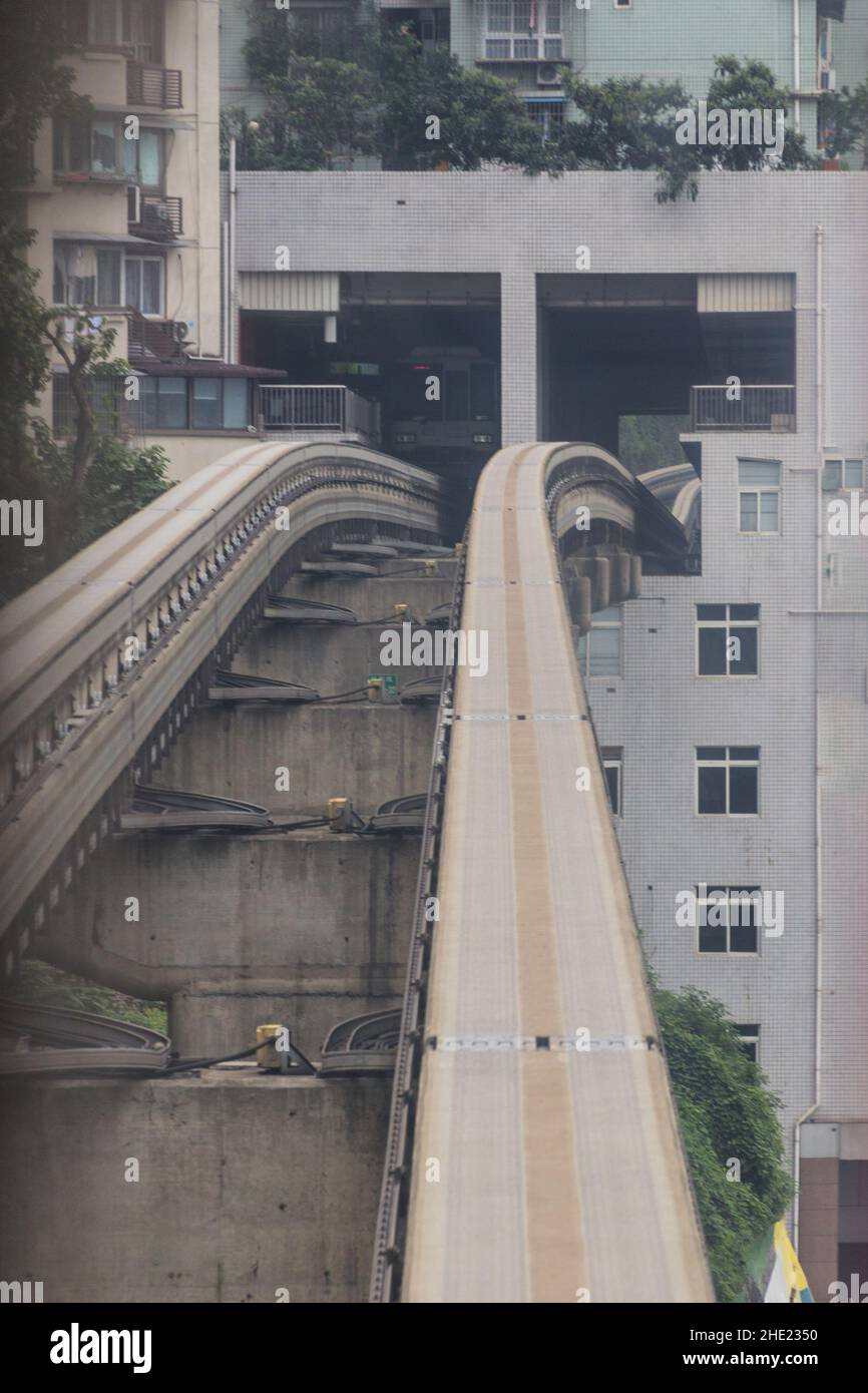 Monorail line through residential building in Chongqing, China Stock ...
