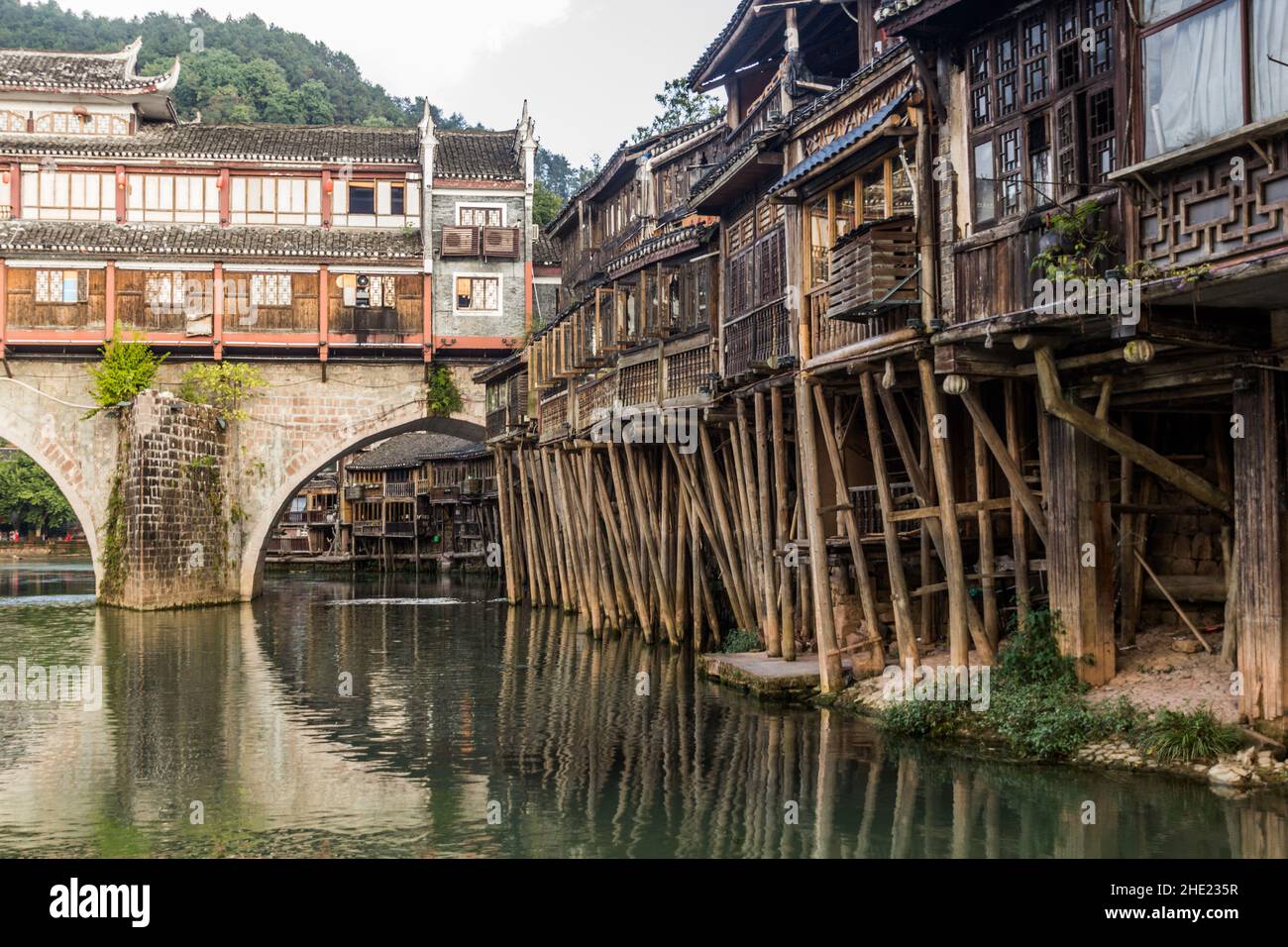 Hong bridge and stilt houses in Fenghuang Ancient Town, Hunan province ...