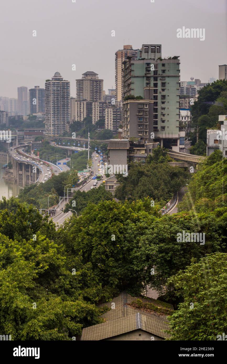 Monorail line through residential building in Chongqing, China Stock ...