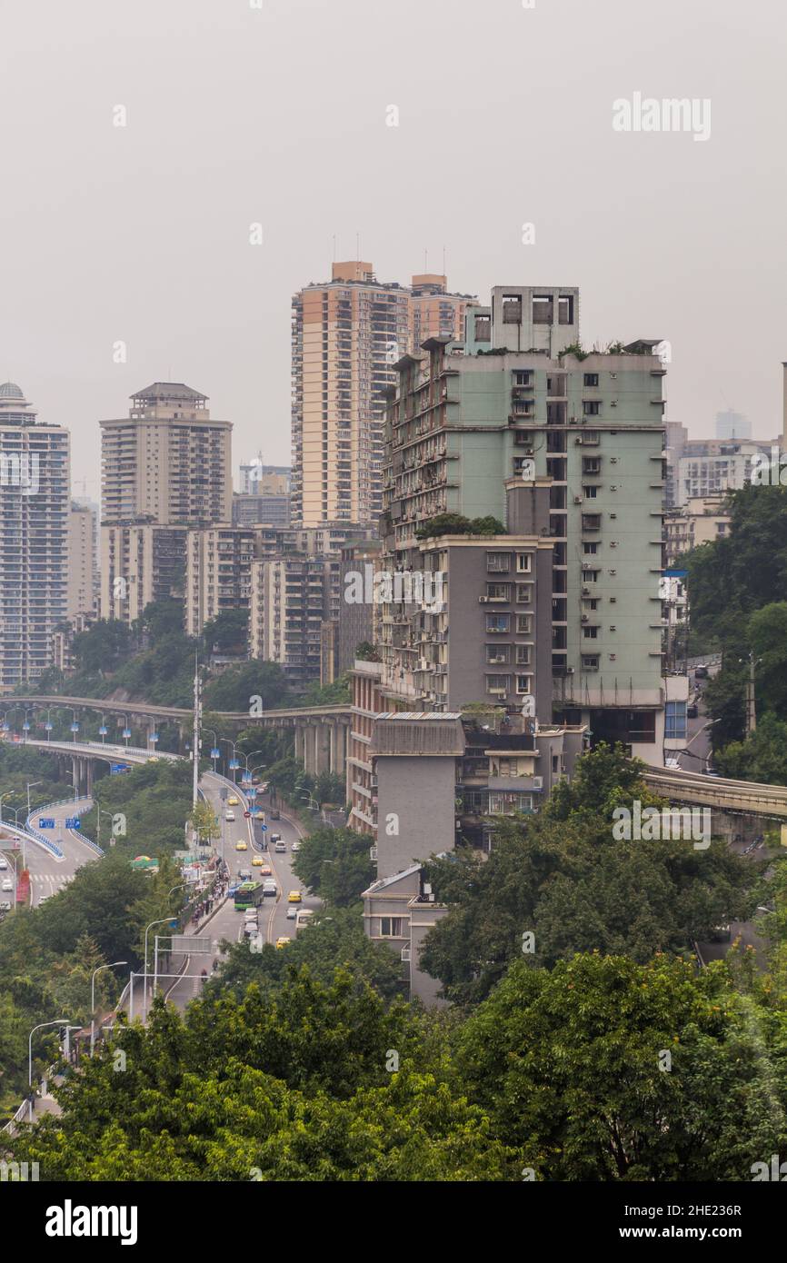 Monorail line through residential building in Chongqing, China Stock ...