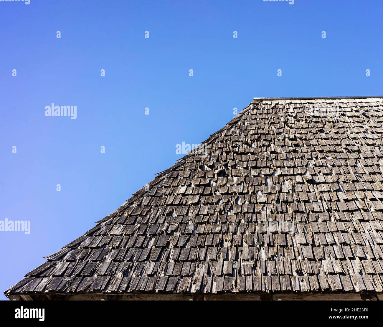Old decayed wooden roof made of shingles with a clear background Stock ...