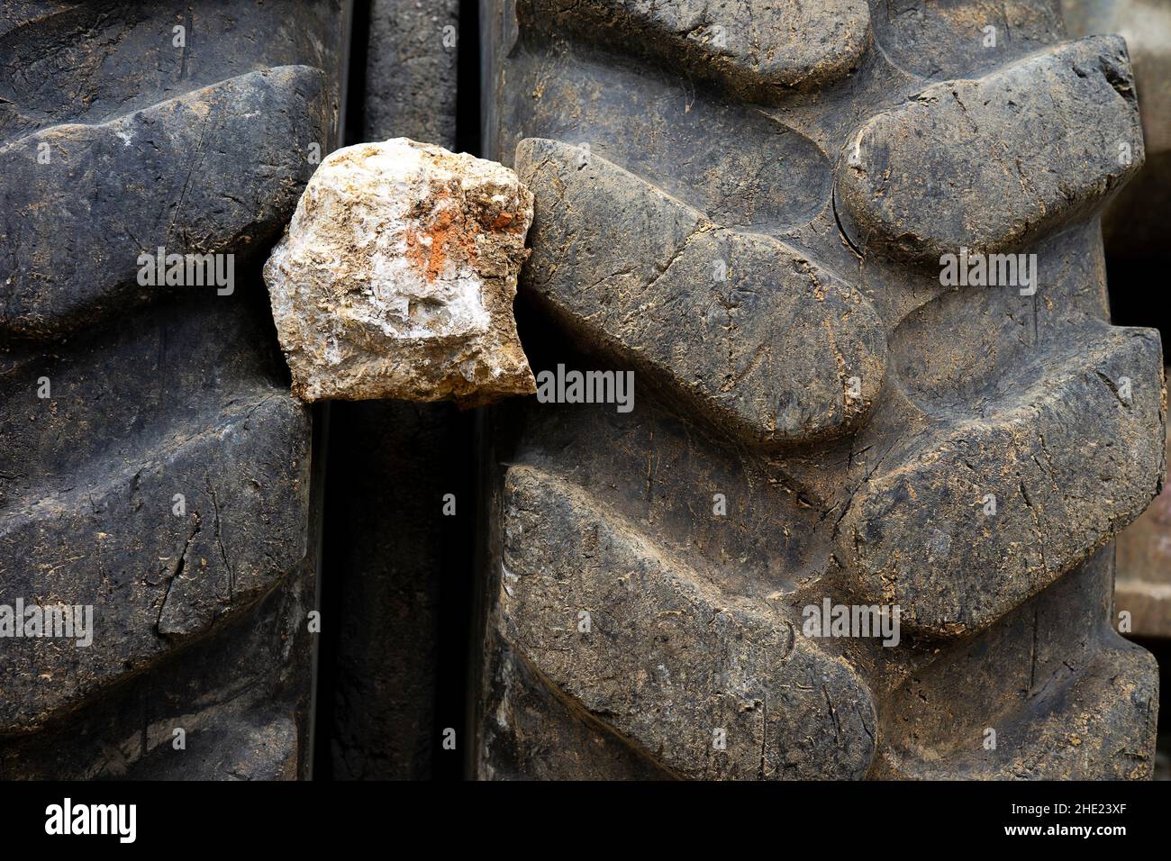 Big tires with a rock stuck in between presenting danger Stock Photo ...