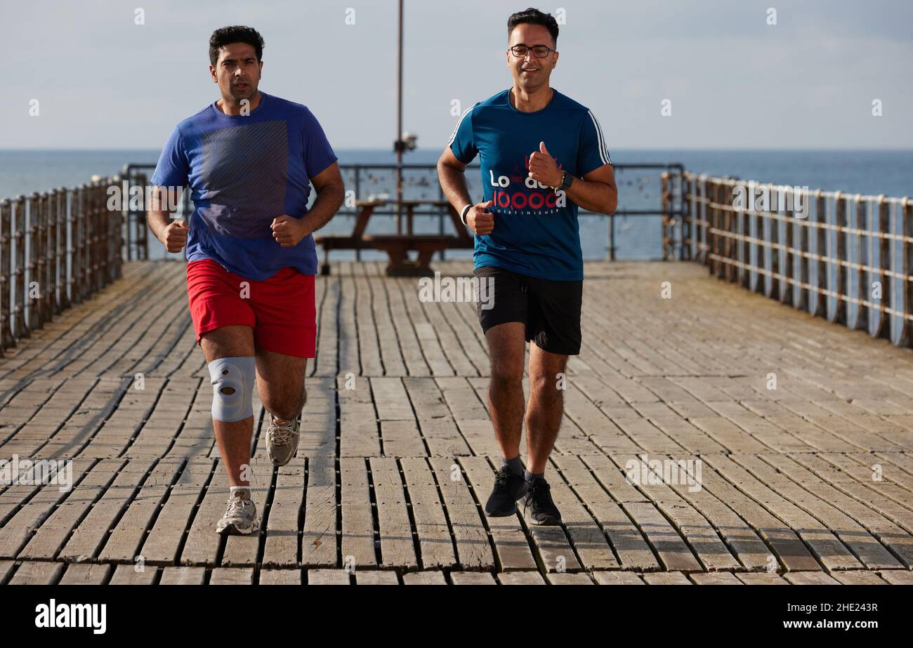 People exercising outdoors on the beachfront of Bognor Regis Stock ...