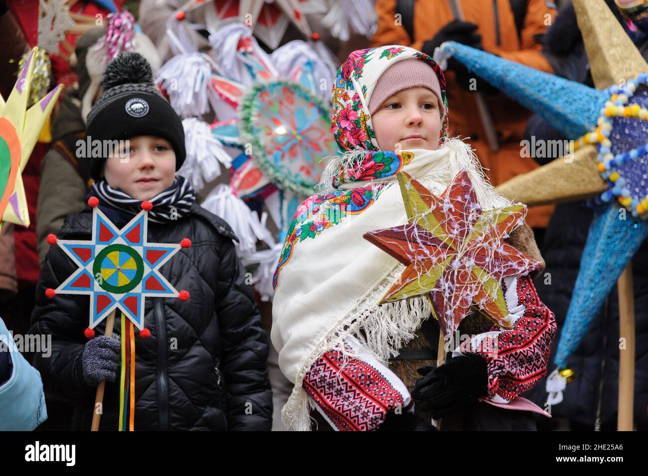 Lviv, Ukraine, 8 January 2022. Children hold stars during procession of ...