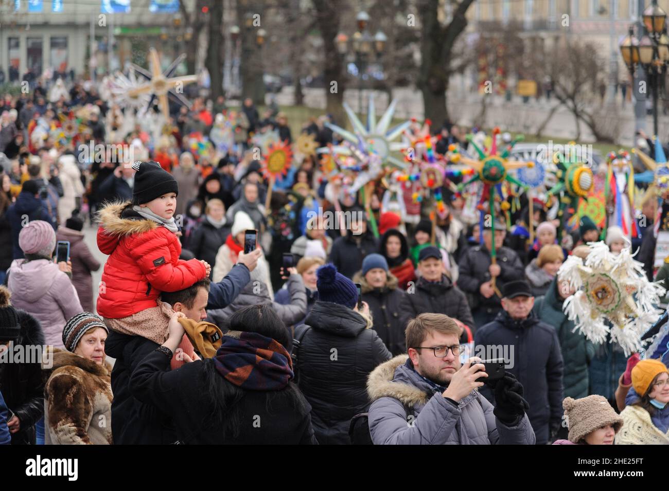 Lviv, Ukraine, 8 January 2022. Little boy watch procession of zvizdari ...