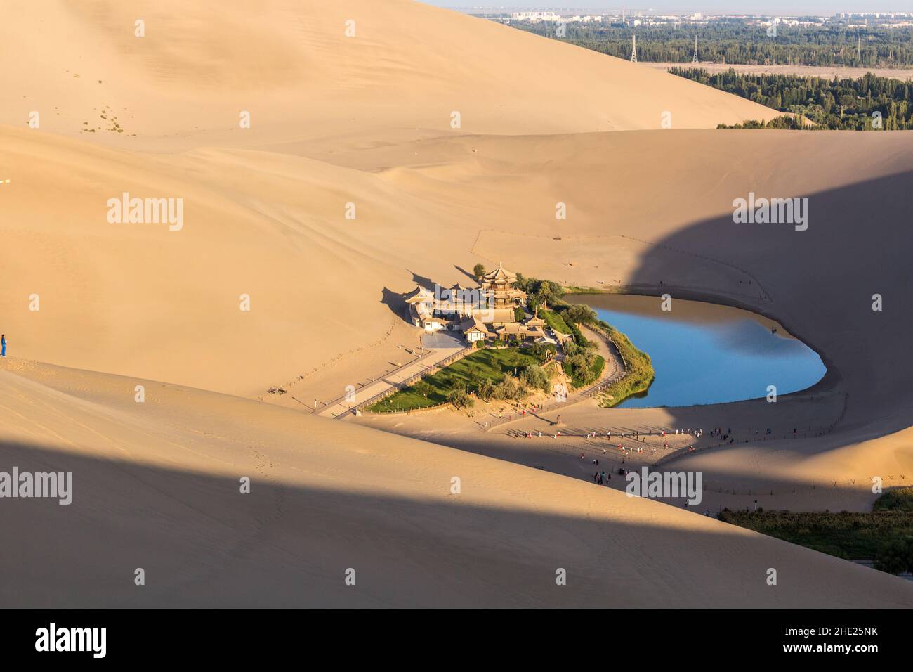 Crescent Moon Lake at Singing Sands Dune near Dunhuang, Gansu Province ...