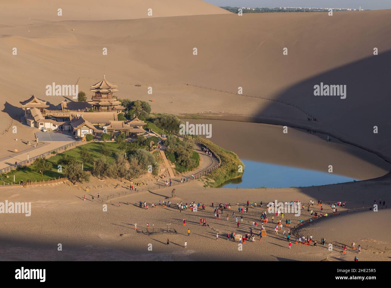 DUNHUANG, CHINA - AUGUST 21, 2018: Crescent Moon Lake at Singing Sands ...