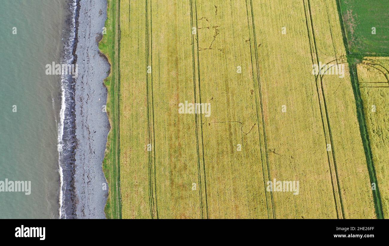Aerial image of fields, beach and coastal path in Llanon Ceredigion ...