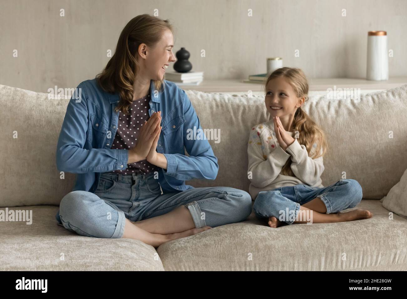 Carefree two generations family doing yoga exercises Stock Photo - Alamy